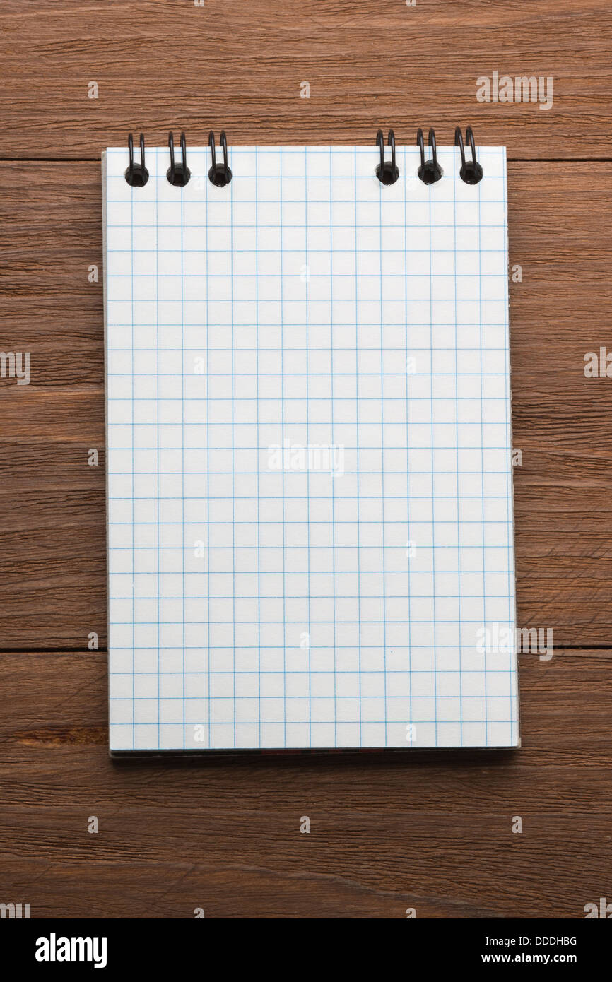 checked paper of on wood background Stock Photo - Alamy