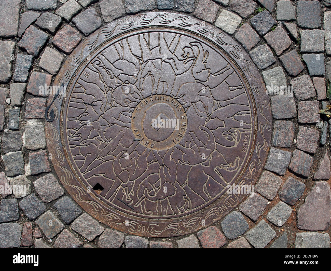 A sewer manhole lid is displayed, a common component of urban ...