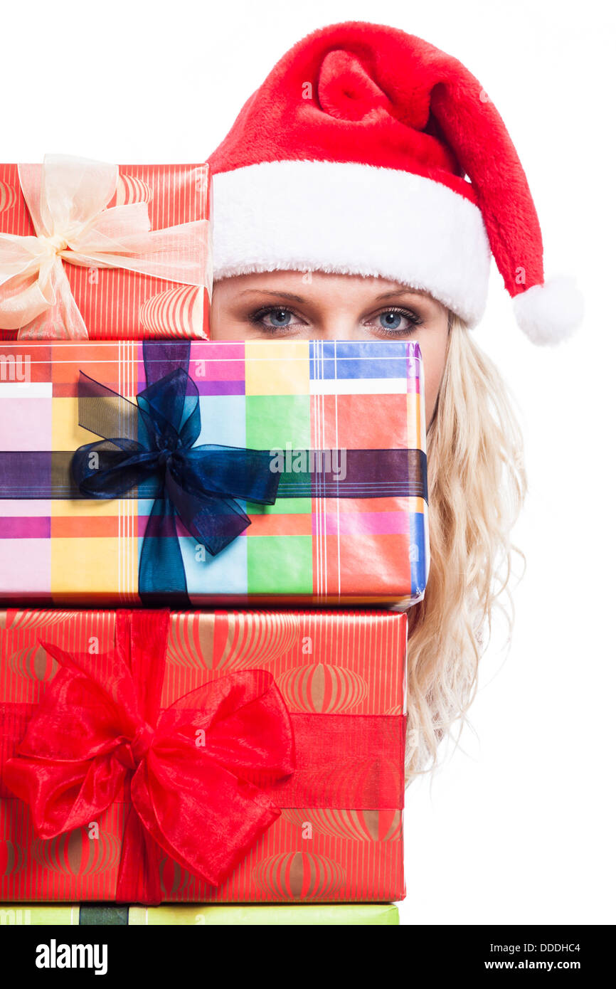 Secret Christmas woman hiding behind many presents, isolated on white ...