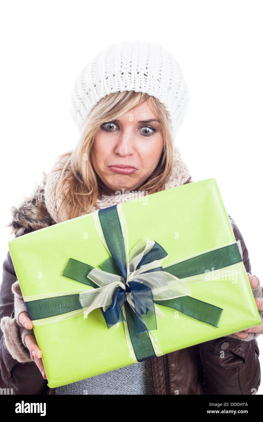 Disappointed woman holding present, isolated on white background Stock ...