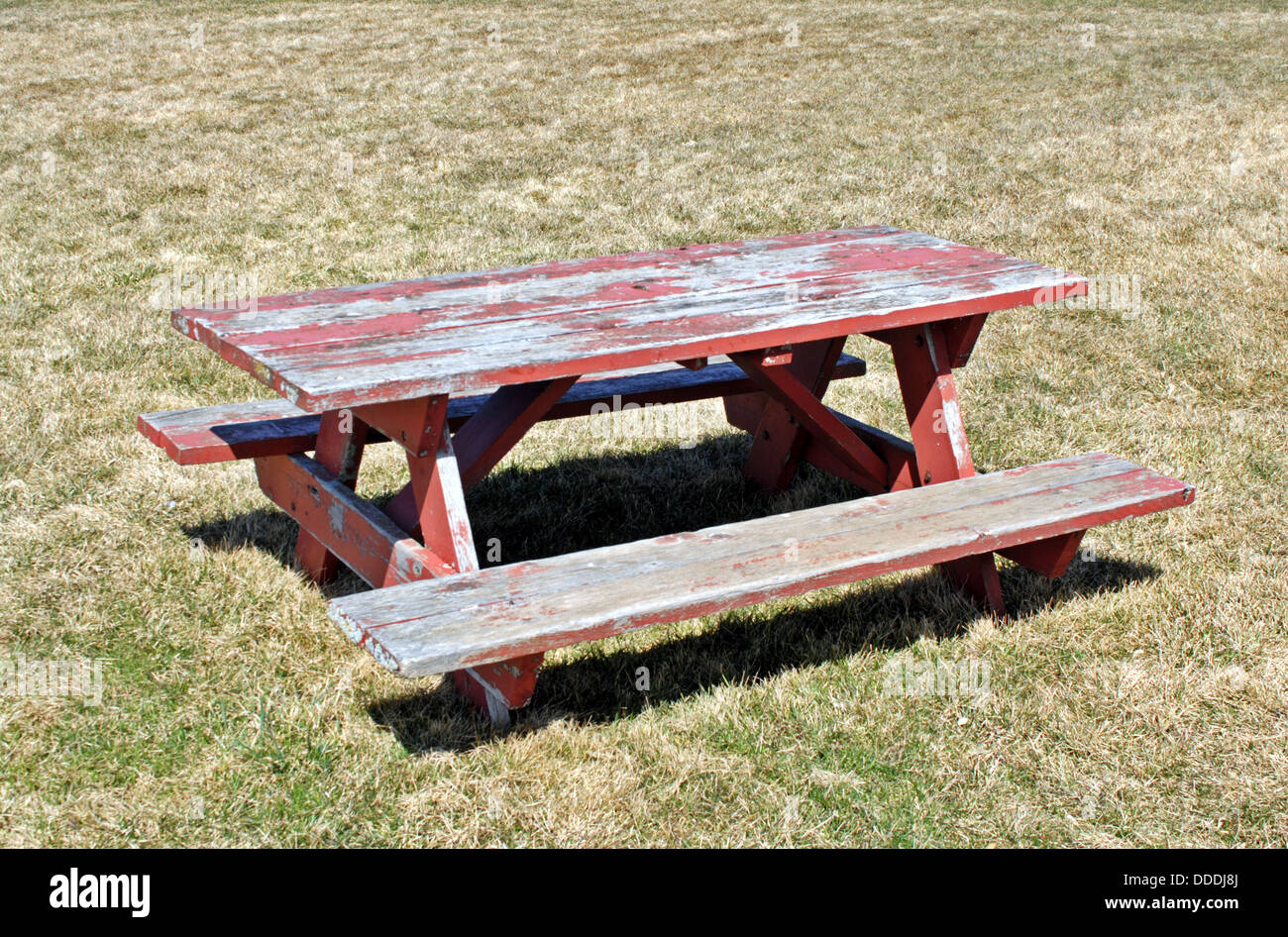 Empty weathered picnic table on dry grass Stock Photo - Alamy