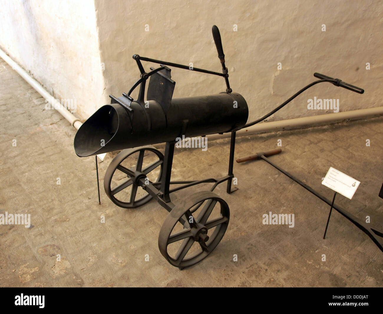 This image depicts a historical transport cart designed to carry ...