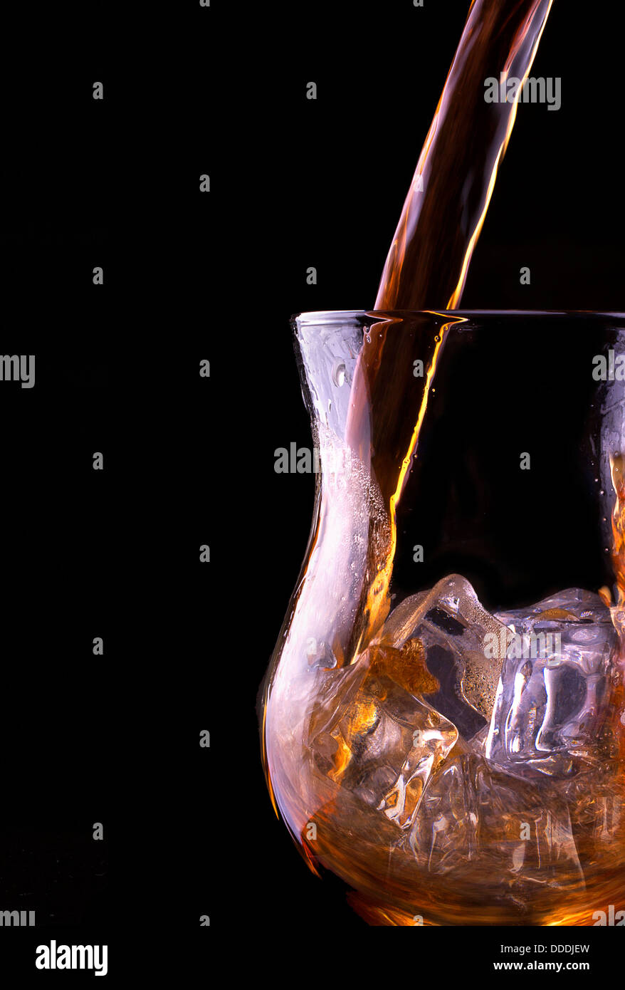 Fresh cola drink background with splash isolated on a black Stock Photo ...