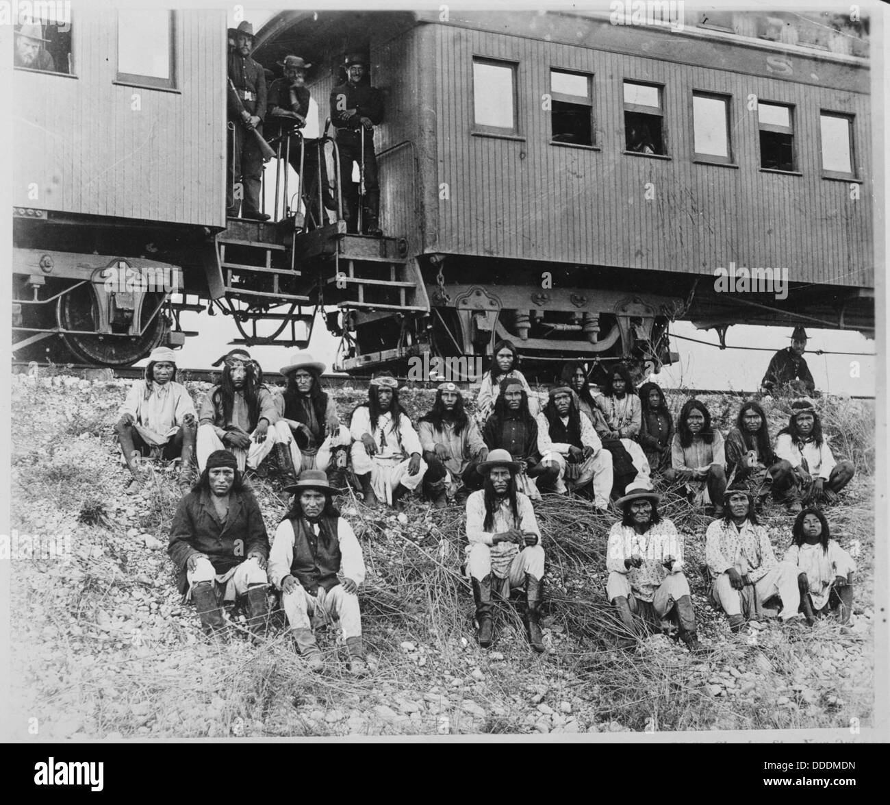 A group of Apache Indian prisoners rests at a stop beside the Southern ...
