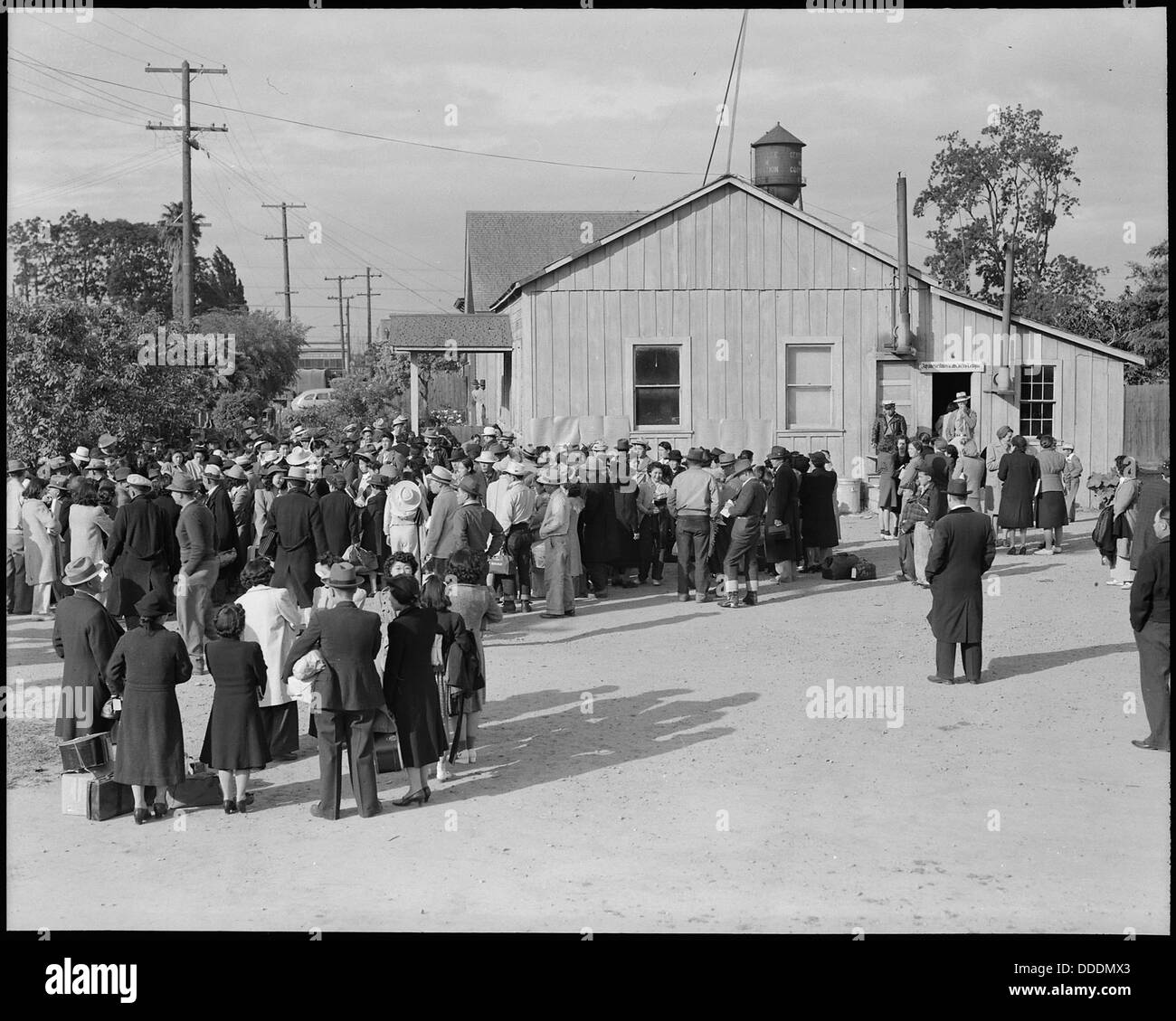 Centerville, California. Members of farm families await evacuation bus ...