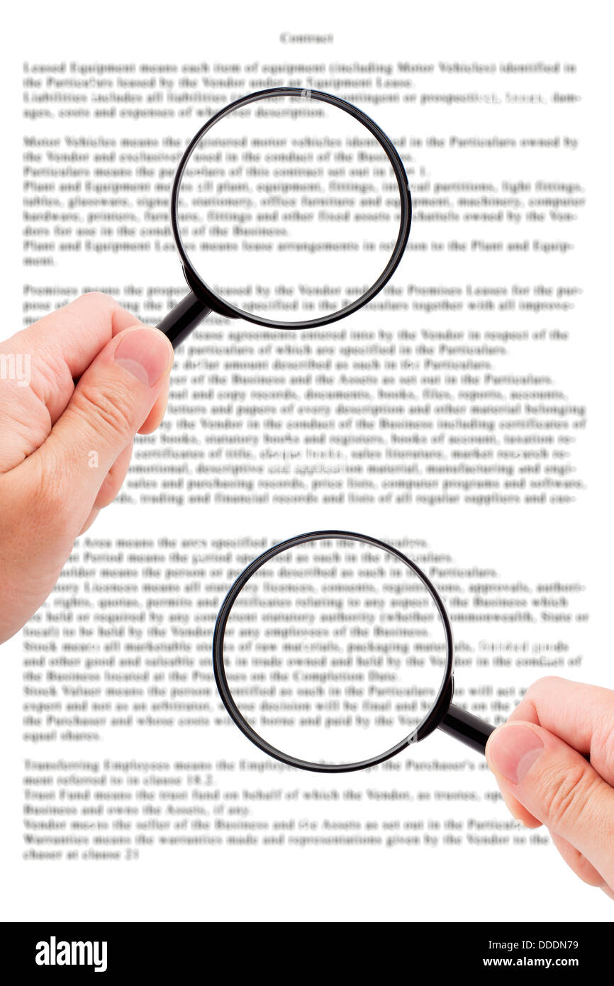 Hands holding magnifying glass reading document Stock Photo - Alamy