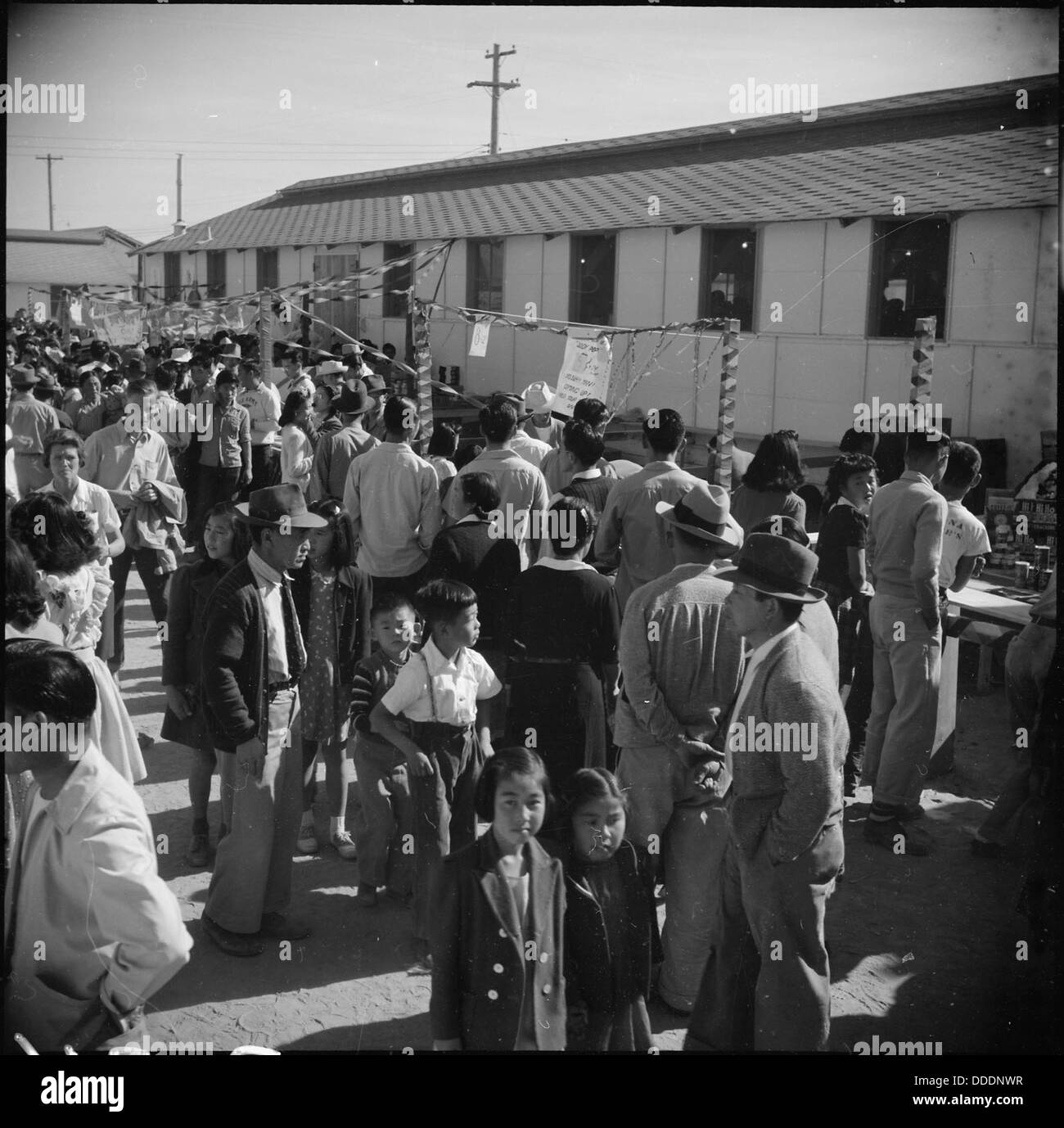 This photograph shows a partial view of a large crowd attending an ...