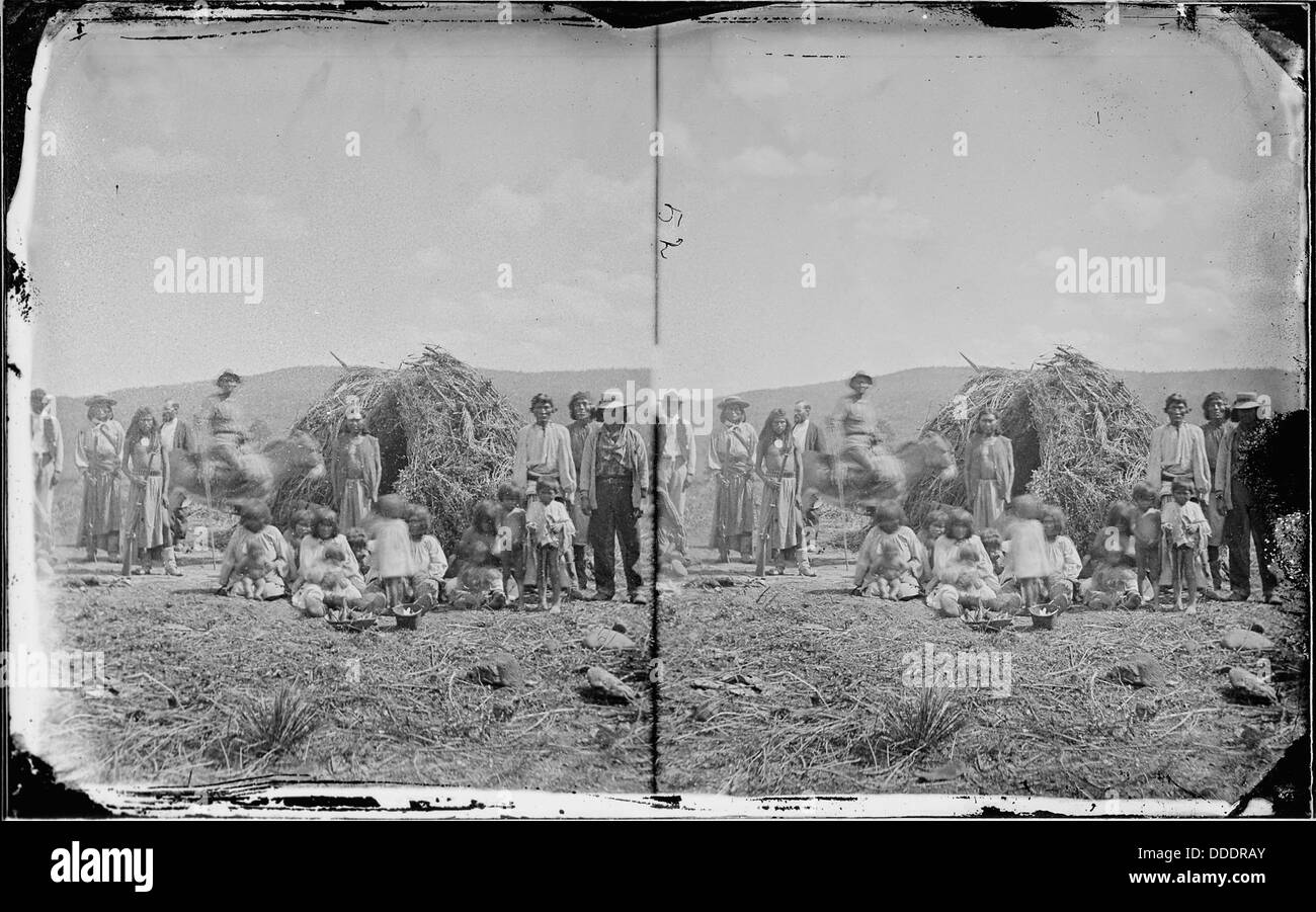 A historical photograph depicting a group of Coyotero Apache near Camp ...