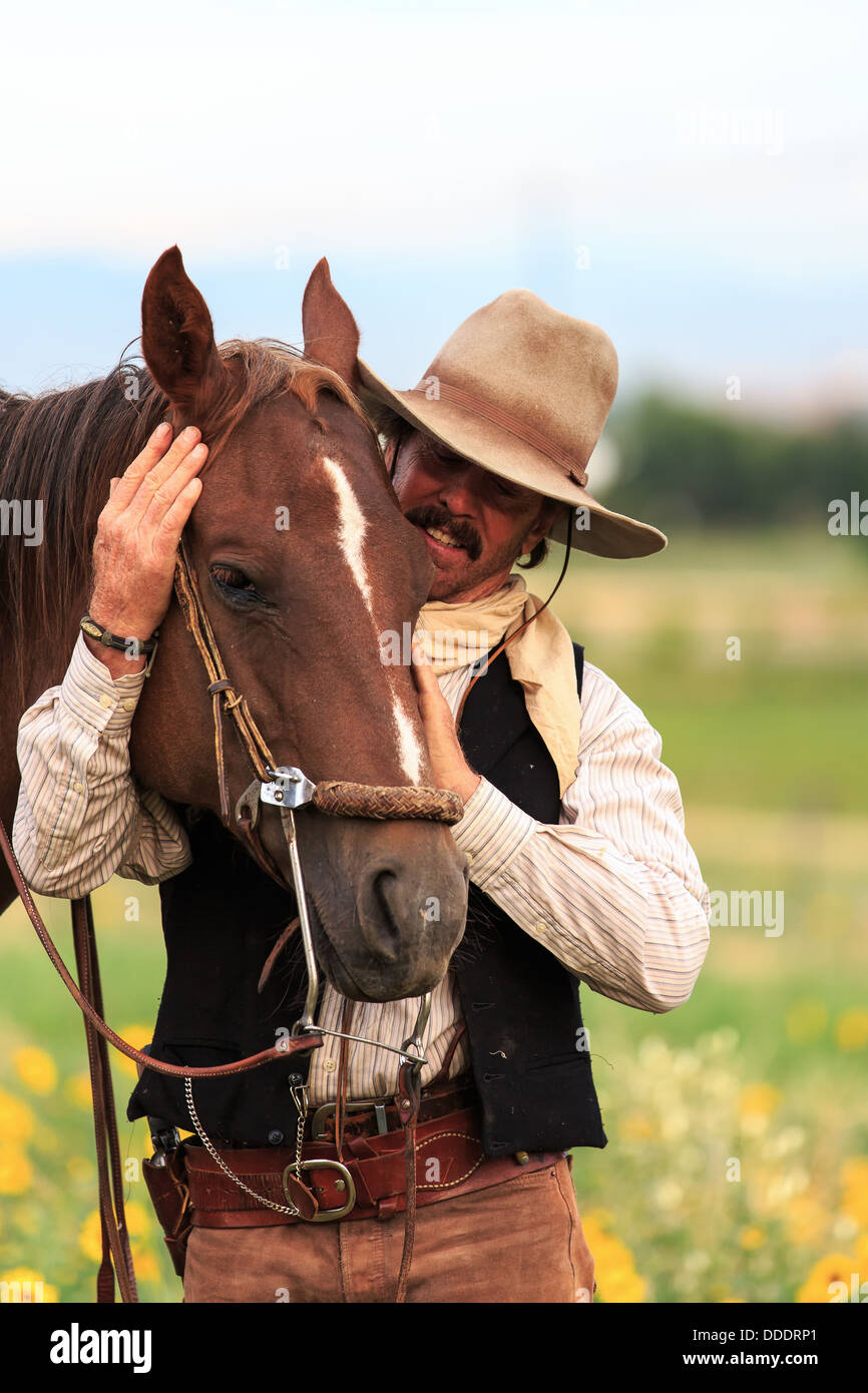 A portrait of a cowboy and his horse Stock Photo - Alamy