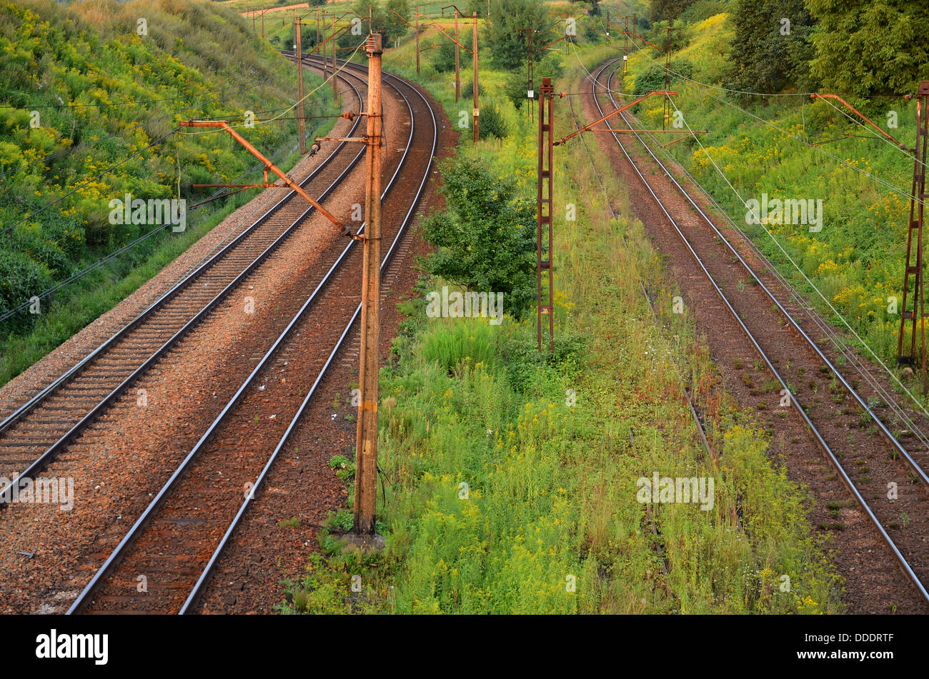 Three railway tracks and power lines Stock Photo - Alamy