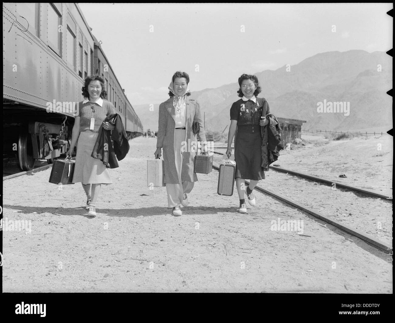 A photograph captures the arrival of newcomers by train at Lone Pine ...