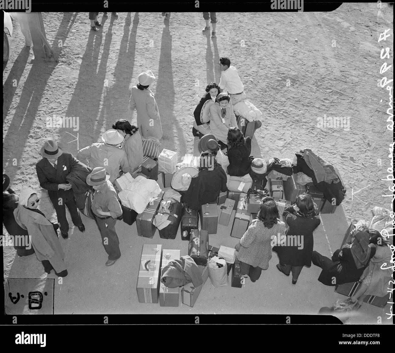 Evacuees of Japanese ancestry wait for transportation to the War ...
