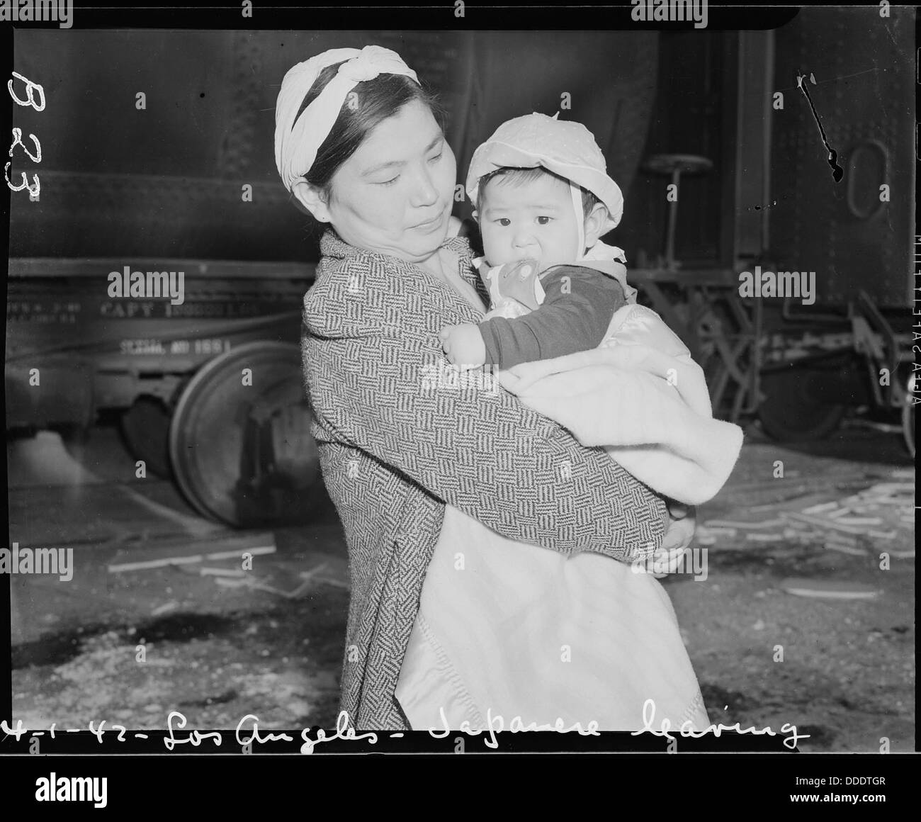 This photograph depicts a mother and child from the Japanese American ...