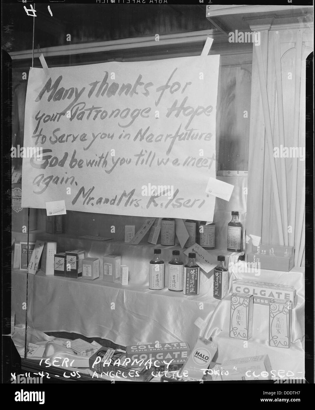 This image shows Mr. and Mrs. K. Tseri closing their drugstore in Los ...