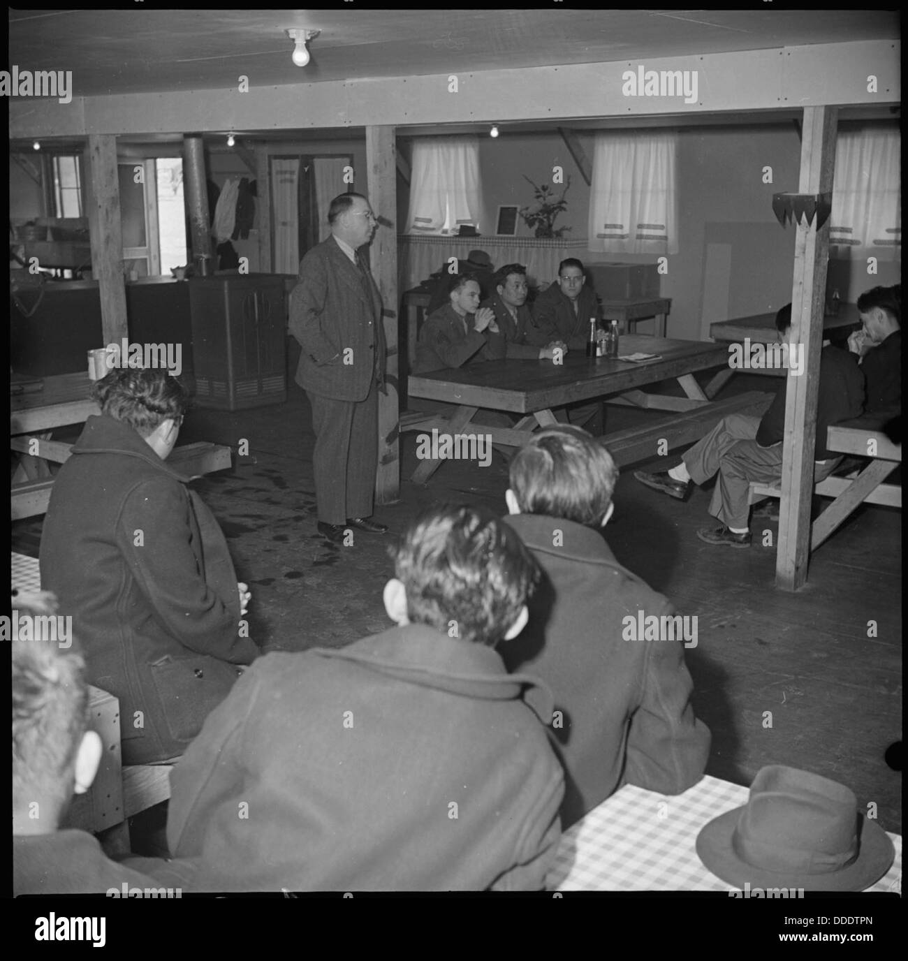 A meeting held in a mess hall at the Manzanar Relocation Center ...