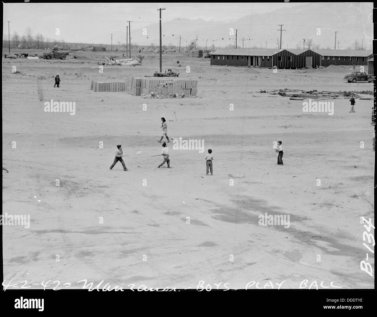 Boys at the Manzanar Relocation Center in California begin a ball game ...