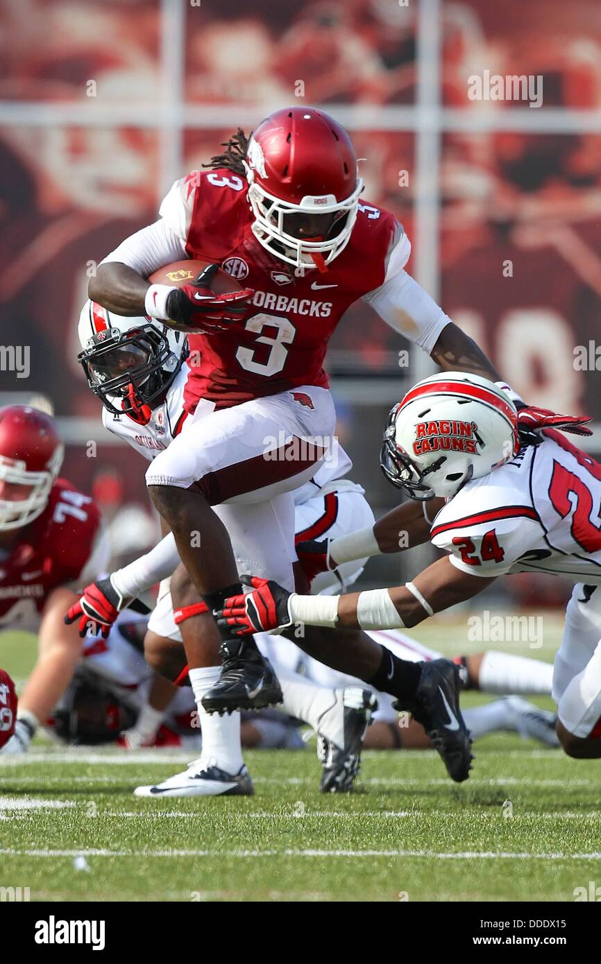 Aug 31, 2013: Razorback running back Alex Collins #3 attempts to stiff ...