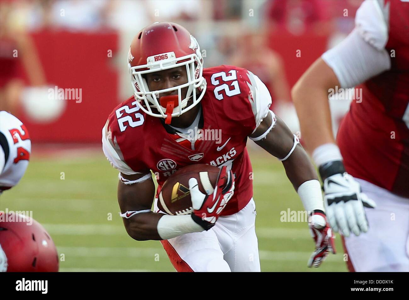 Aug 31, 2013: Razorback running back Nate Holmes #22 looks for an area ...
