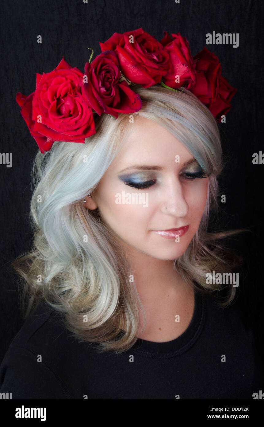 A beauty photograph of young woman/model adorned with red roses Stock ...