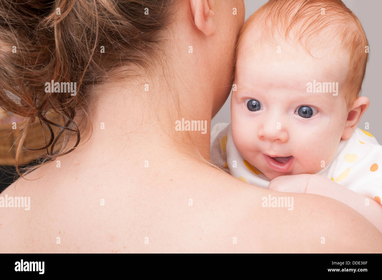 Mother from Behind Holding Happy Newborn Baby Stock Photo - Alamy