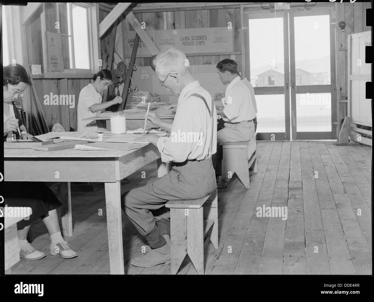 The image shows students at the Art School at the Manzanar Relocation ...