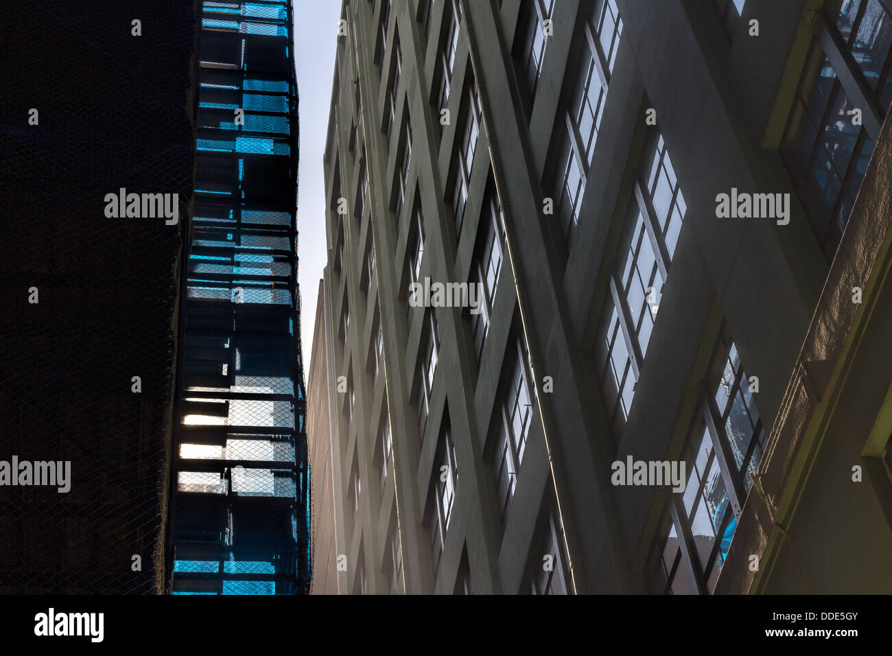 Hazy light filters through into a dark alley Stock Photo - Alamy