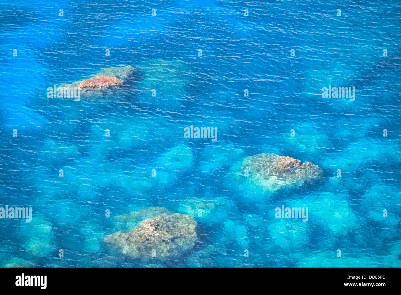Blue glassy water surface with ripple and reflection of sunlight Stock ...