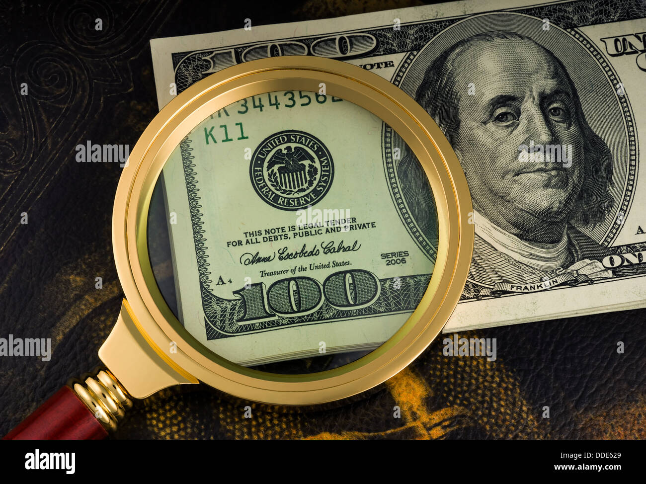 Magnifying glass with a dollar sign hi-res stock photography and images ...