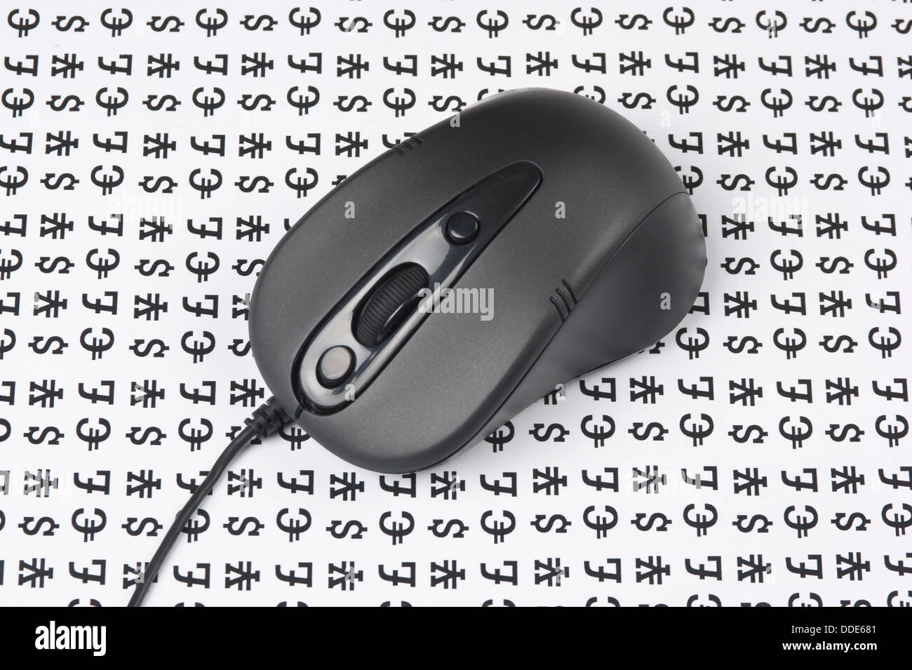computer mouse on a background of signs of money Stock Photo - Alamy
