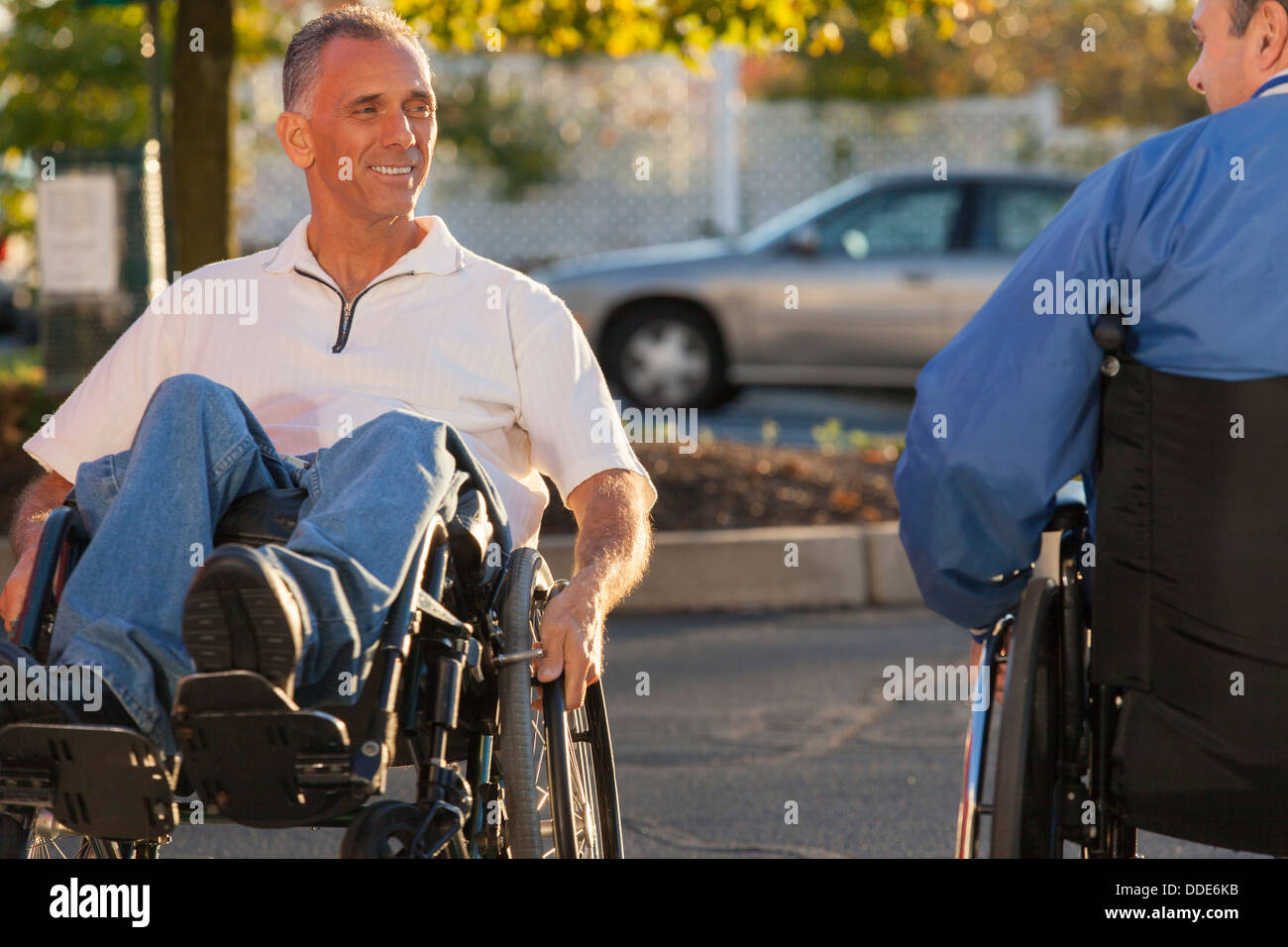Man with spinal cord injury doing tricks in his wheelchair Stock Photo ...