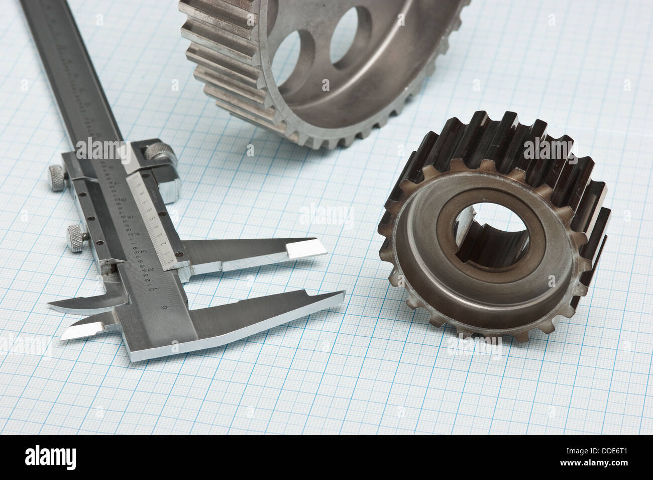 gears and caliper on graph paper Stock Photo - Alamy