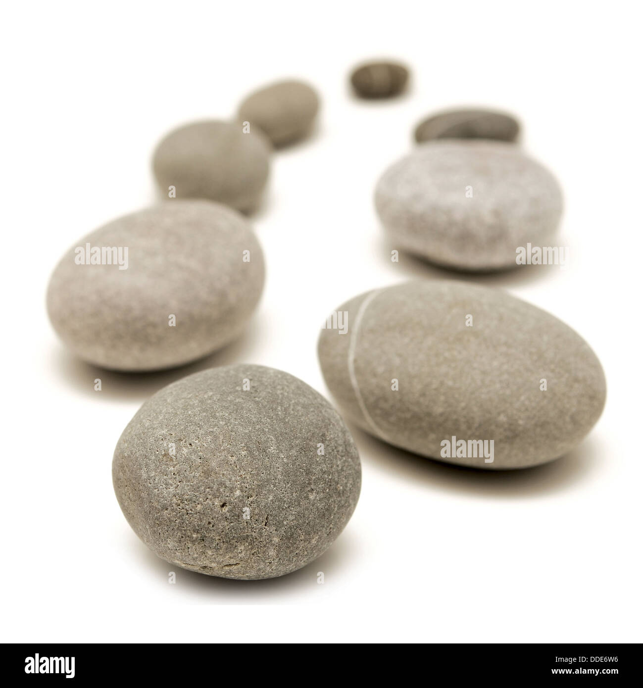 round stones isolated on a white background Stock Photo - Alamy
