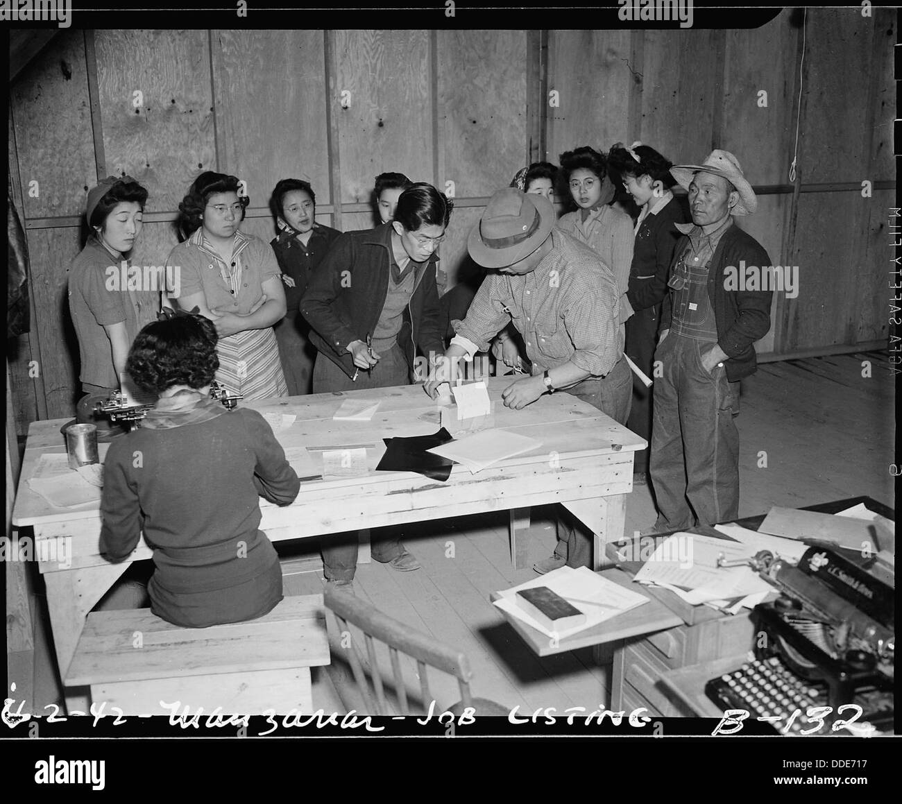 At the Manzanar Relocation Center in California, individuals register ...