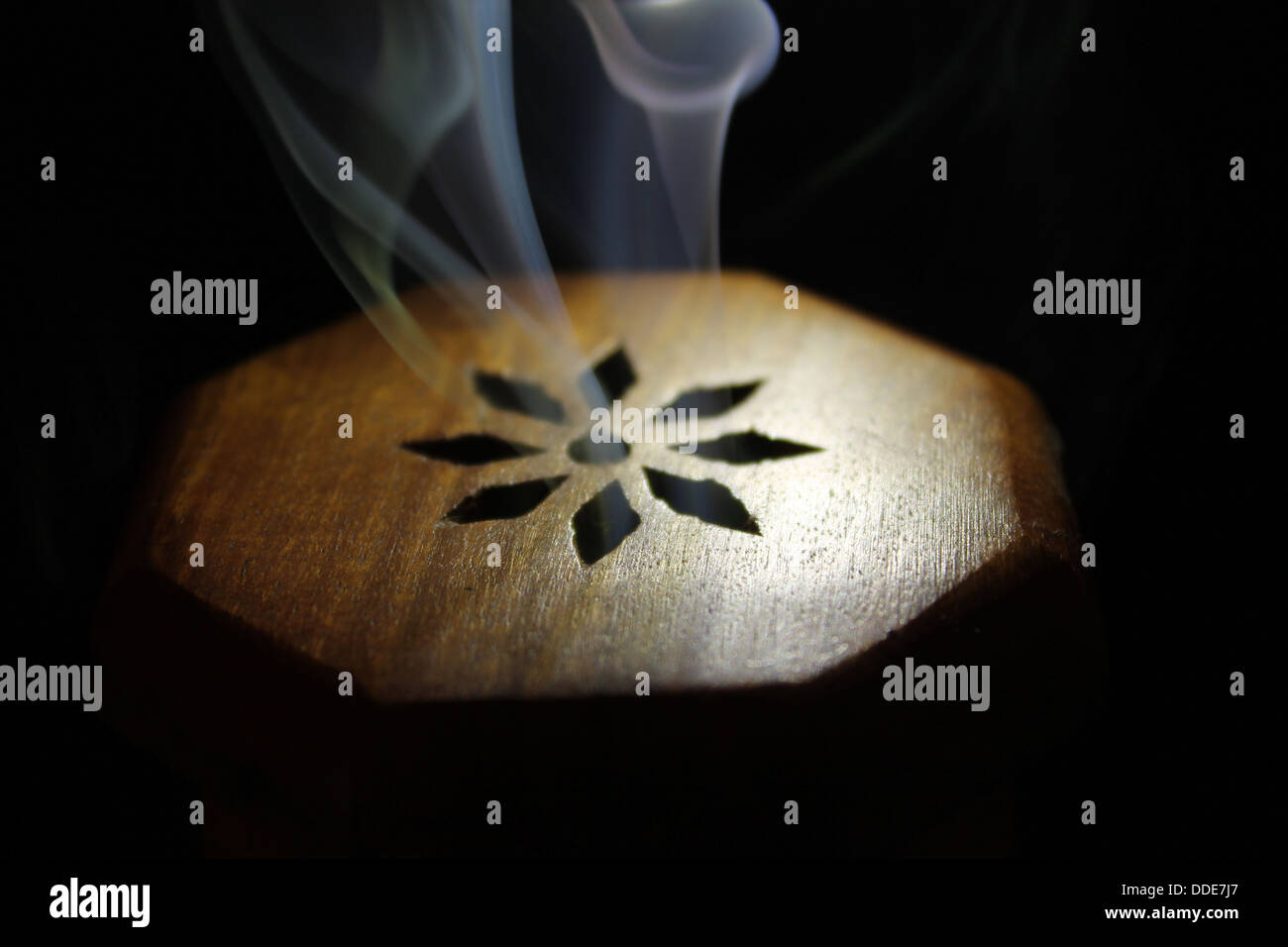 Smoke rising from an incense burner Stock Photo - Alamy
