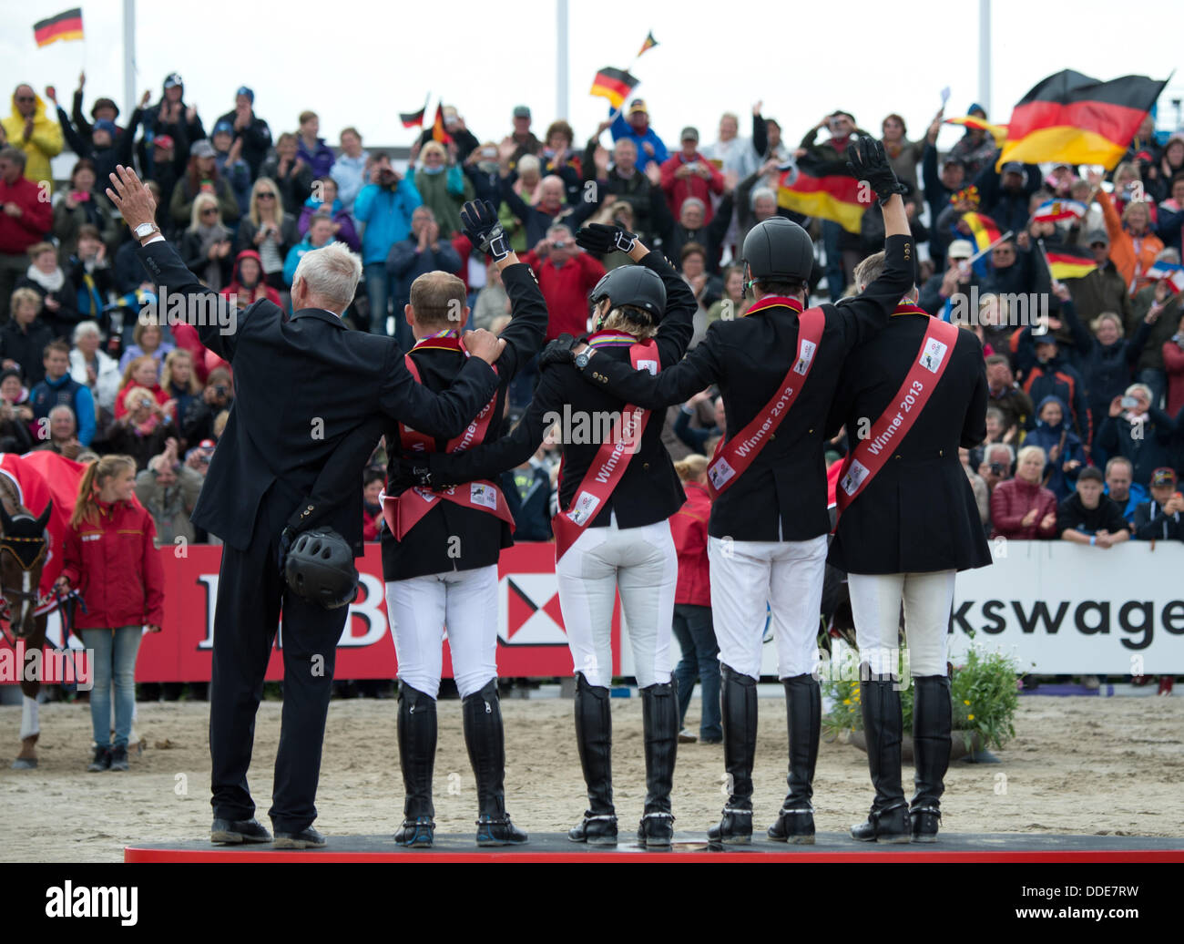 German coach Hans Melzer (L-R) stands next to the eventers Michael Jung ...
