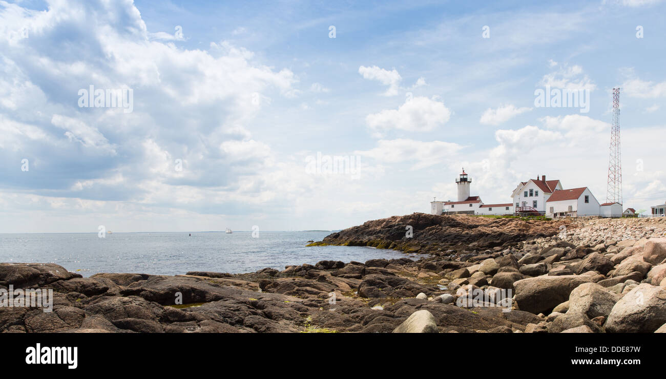 This is the Eastern Point Lighthouse sitting on a point of land ...