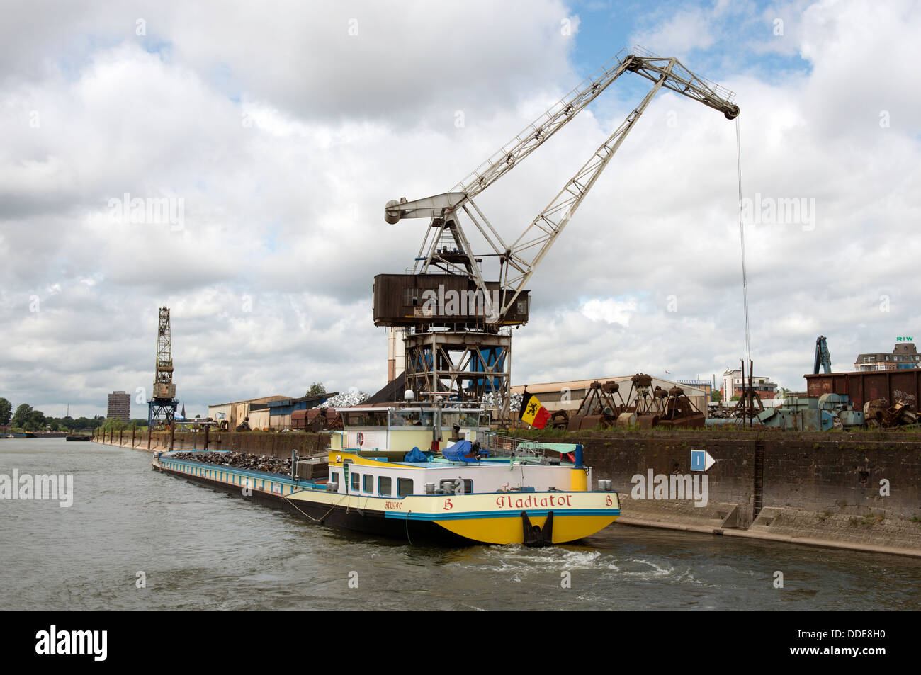 Barge unloading scrap metal for recycling Stock Photo - Alamy