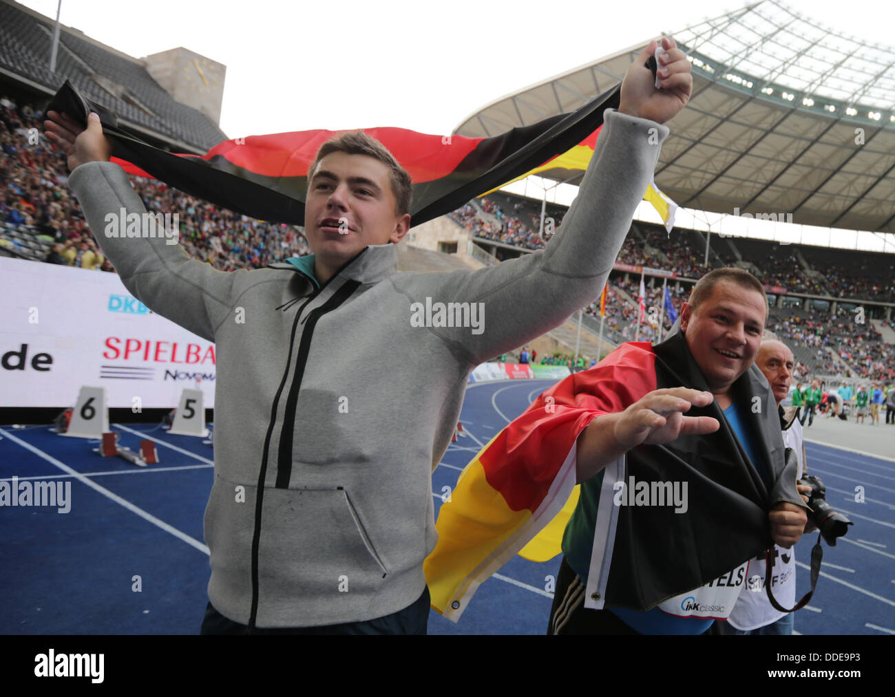 Germany's David Storl (L) and Ralf Bartels celebrate after the shot put ...