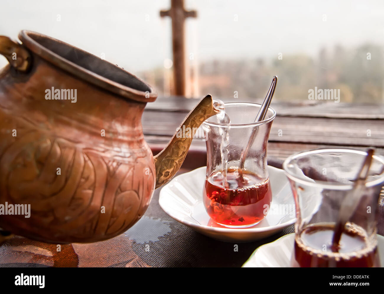 Drinking traditional Turkish Tea with Turkish tea cup and copper tea ...