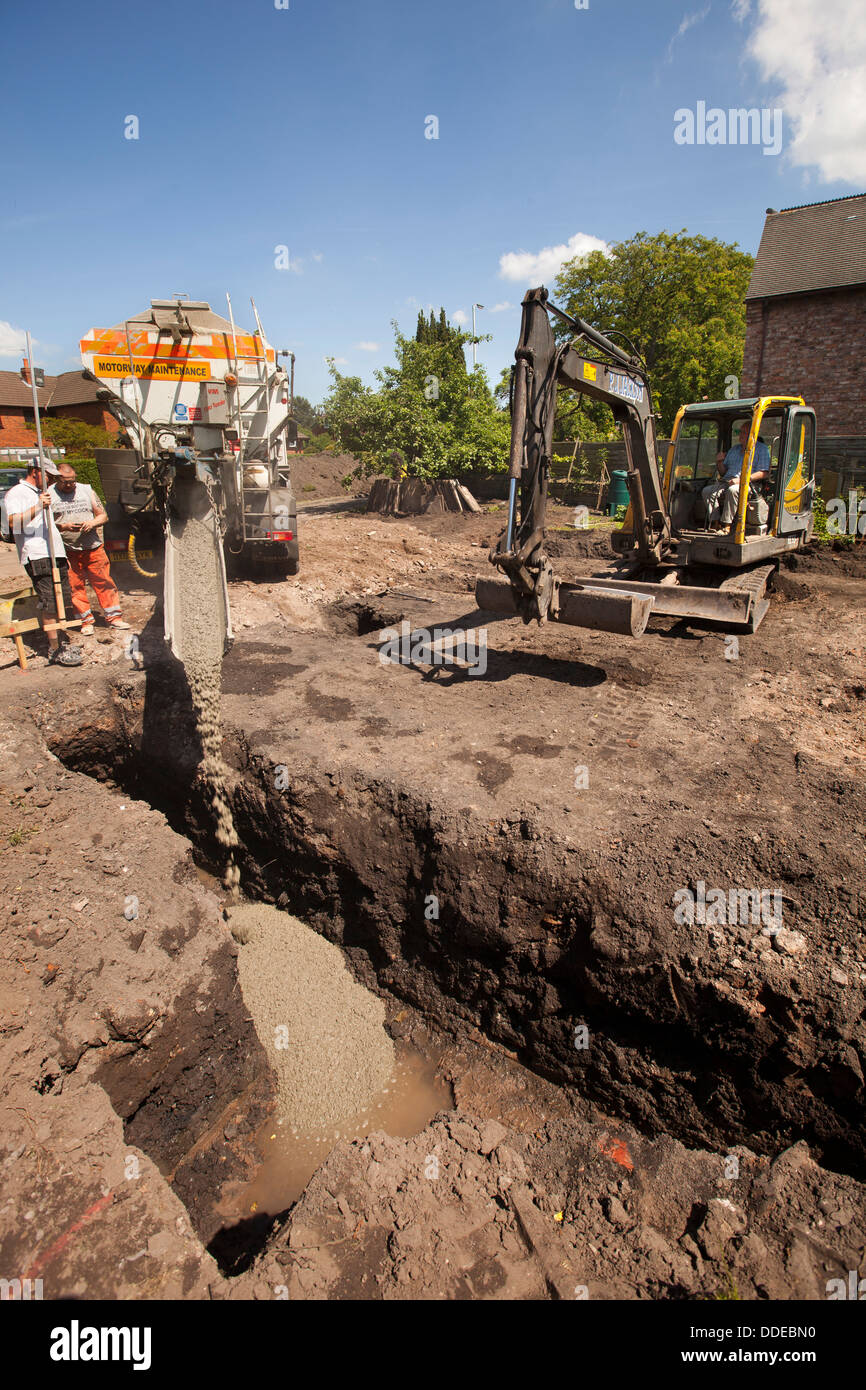 self building house, concrete foundations being poured after volvo ...