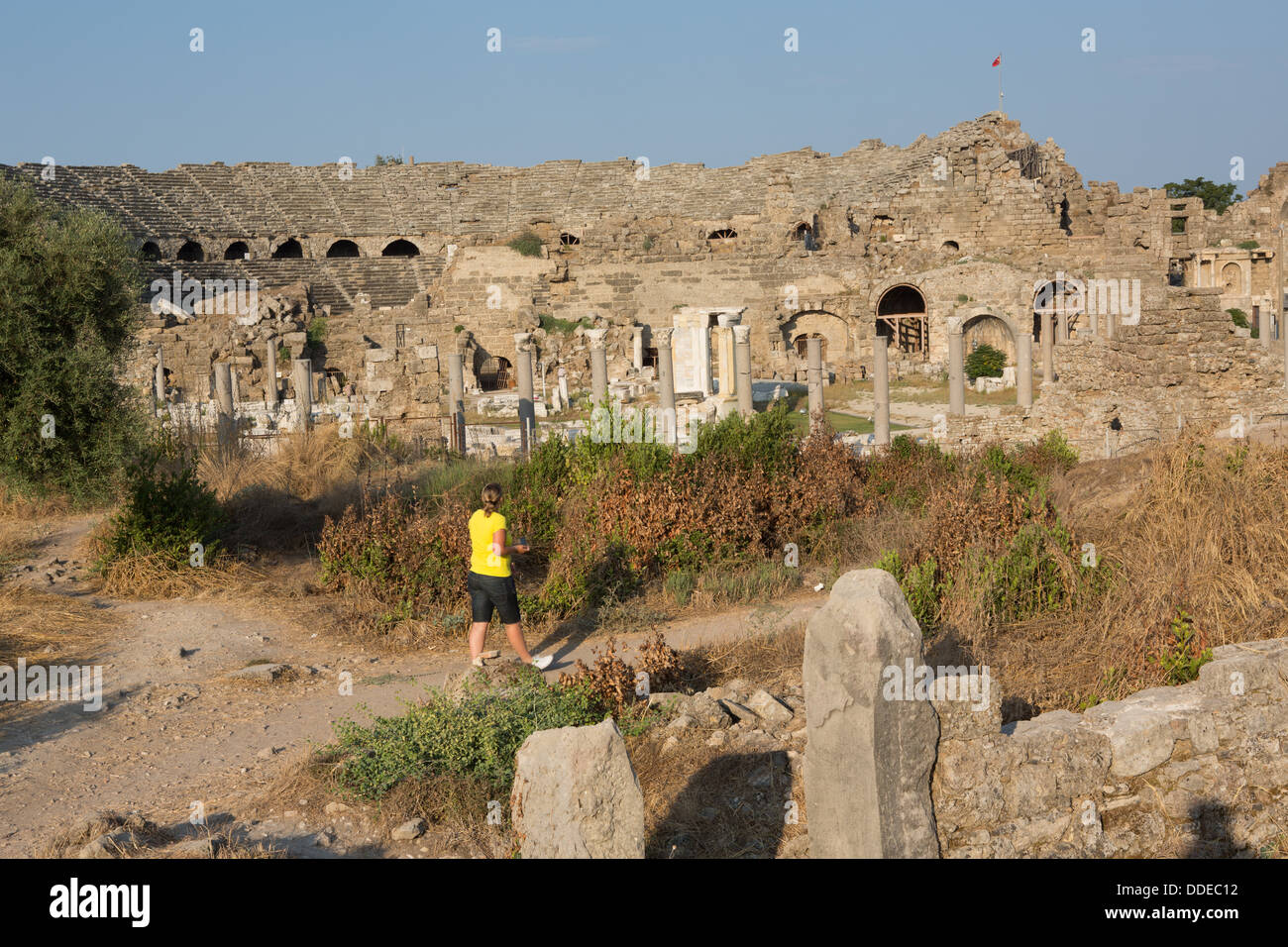 A tourist views the Roman Amphitheatre at Side, Turkey Stock Photo - Alamy