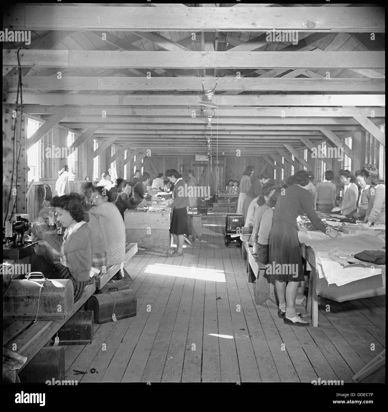 A photograph from Poston, Arizona, showing a sewing school at the War ...