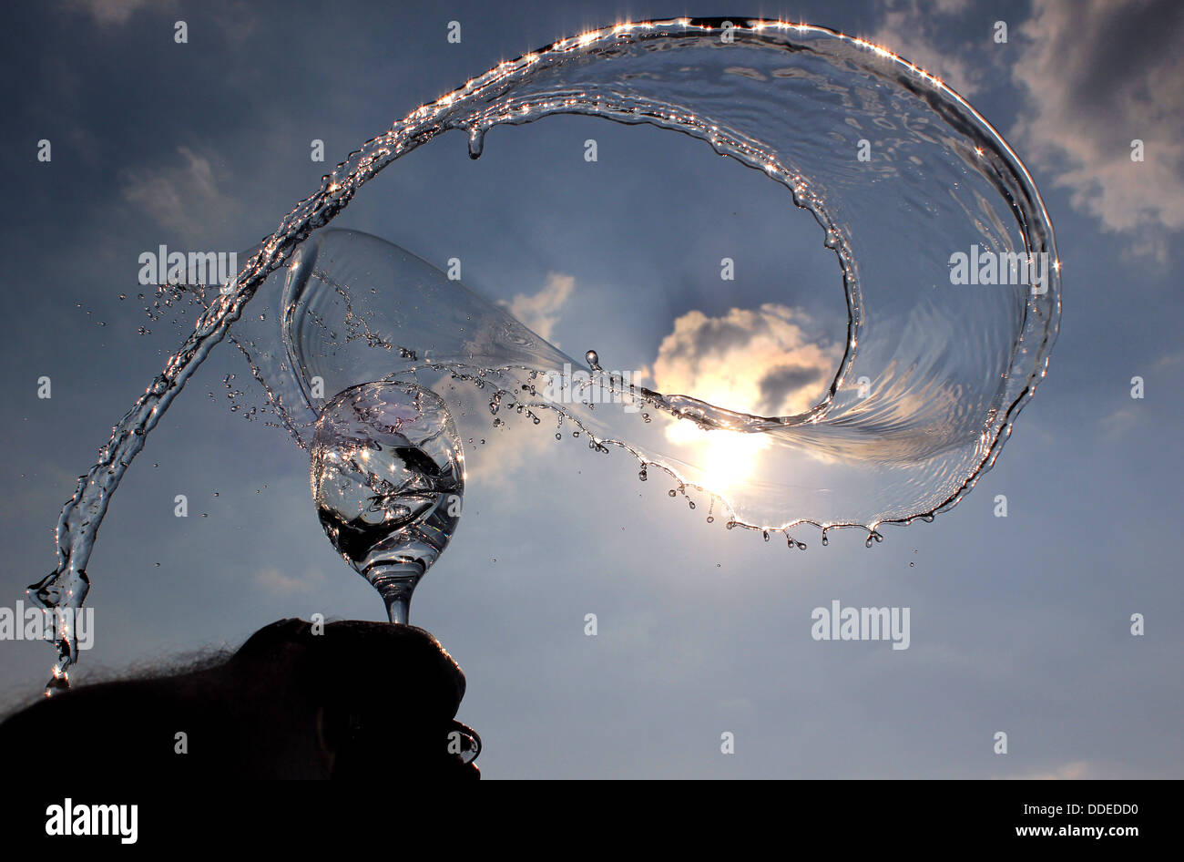 Water splashing from wine glass Stock Photo - Alamy