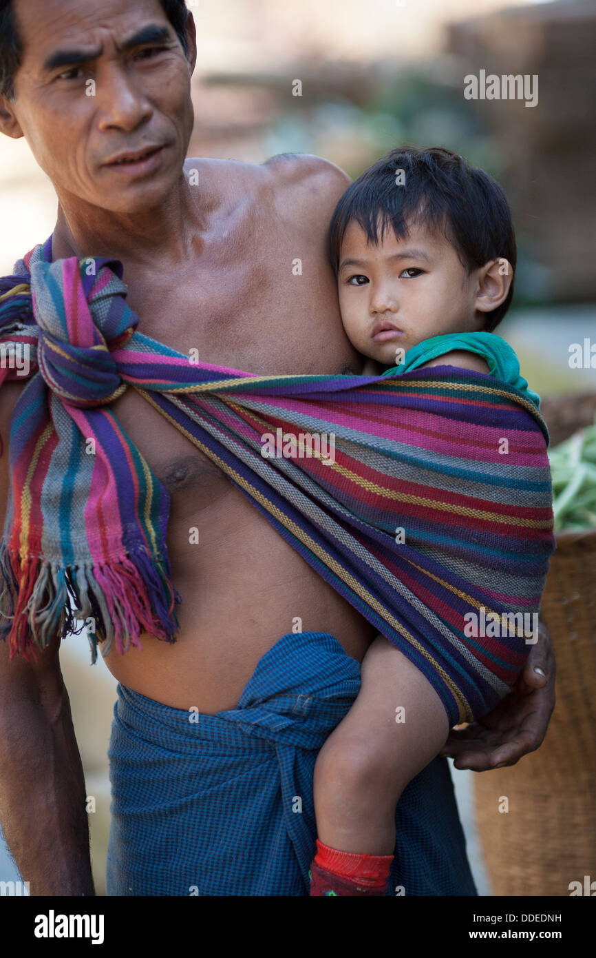 A Bom male carries his child in a traditional sling close to Bandarban ...