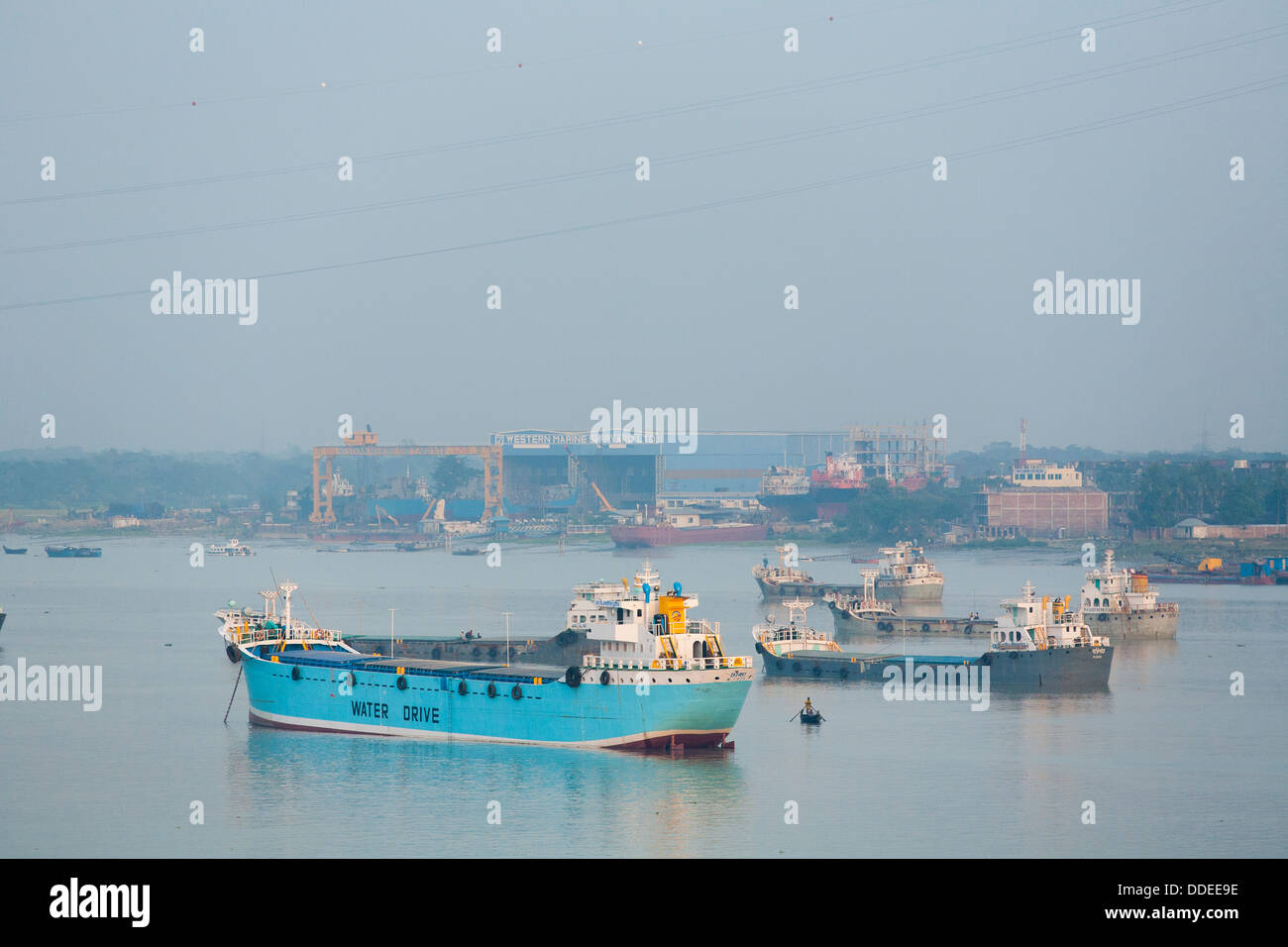 Cargo ships anchored at dusk in the Port of Chittagong on the ...