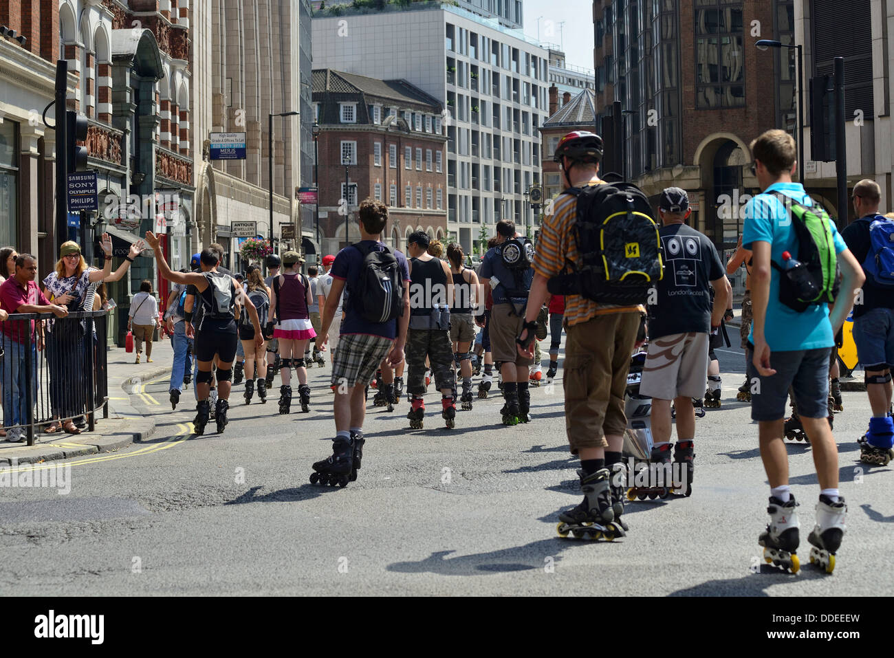 Rollerskaters skating through London streets Stock Photo - Alamy