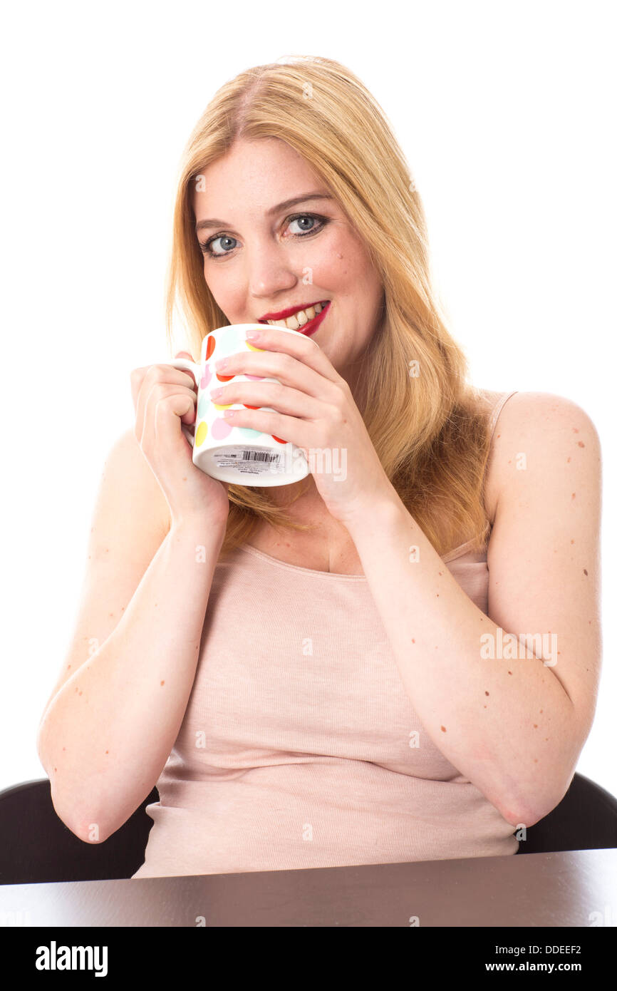 Model Released. Attractive Young Woman Drinking Coffee Stock Photo - Alamy