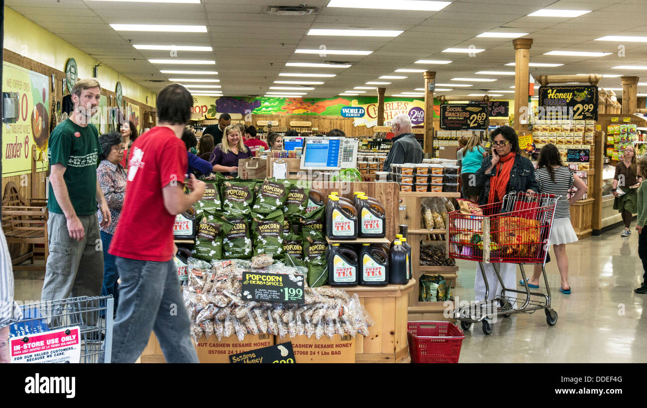customers with shopping carts crowd ends of diagonal aisles feeding ...