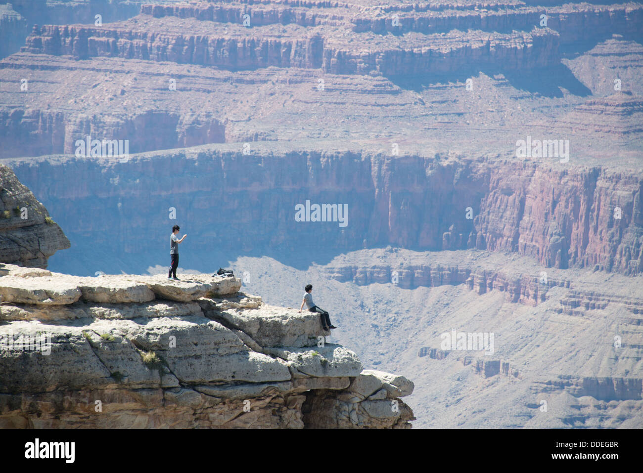 People on Cliff in Grand Canyon Stock Photo - Alamy