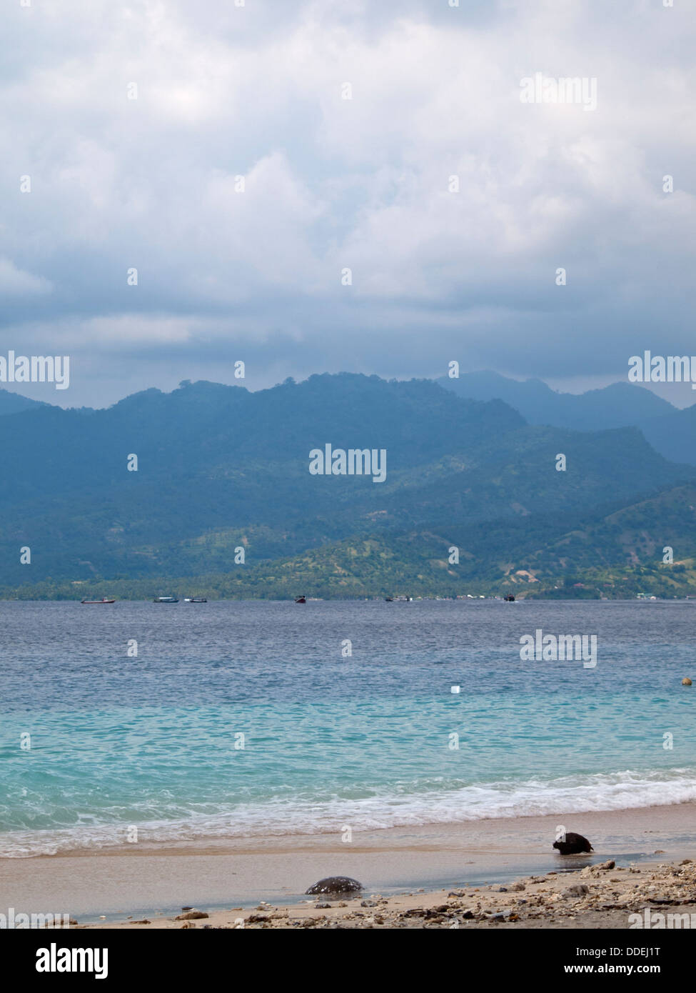 Tropical sea beach in Gili Trawangan with Lombok island in background ...